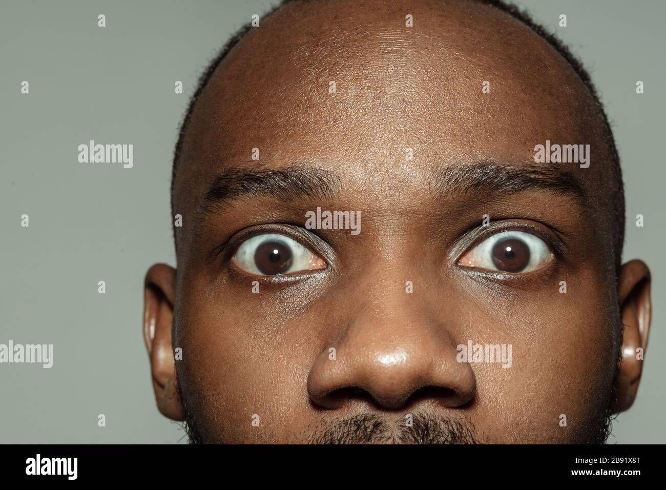 Shocked. Close up of face of beautiful african-american young man ...