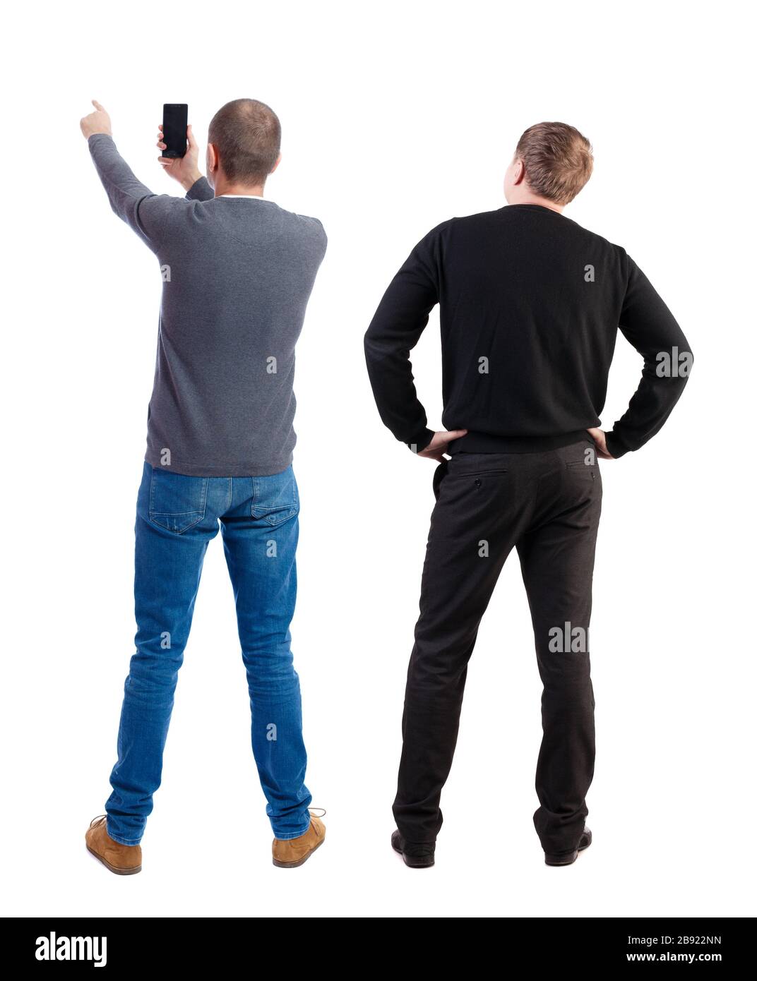 Back view of two man in sweater with mobile phone. Rear view people ...
