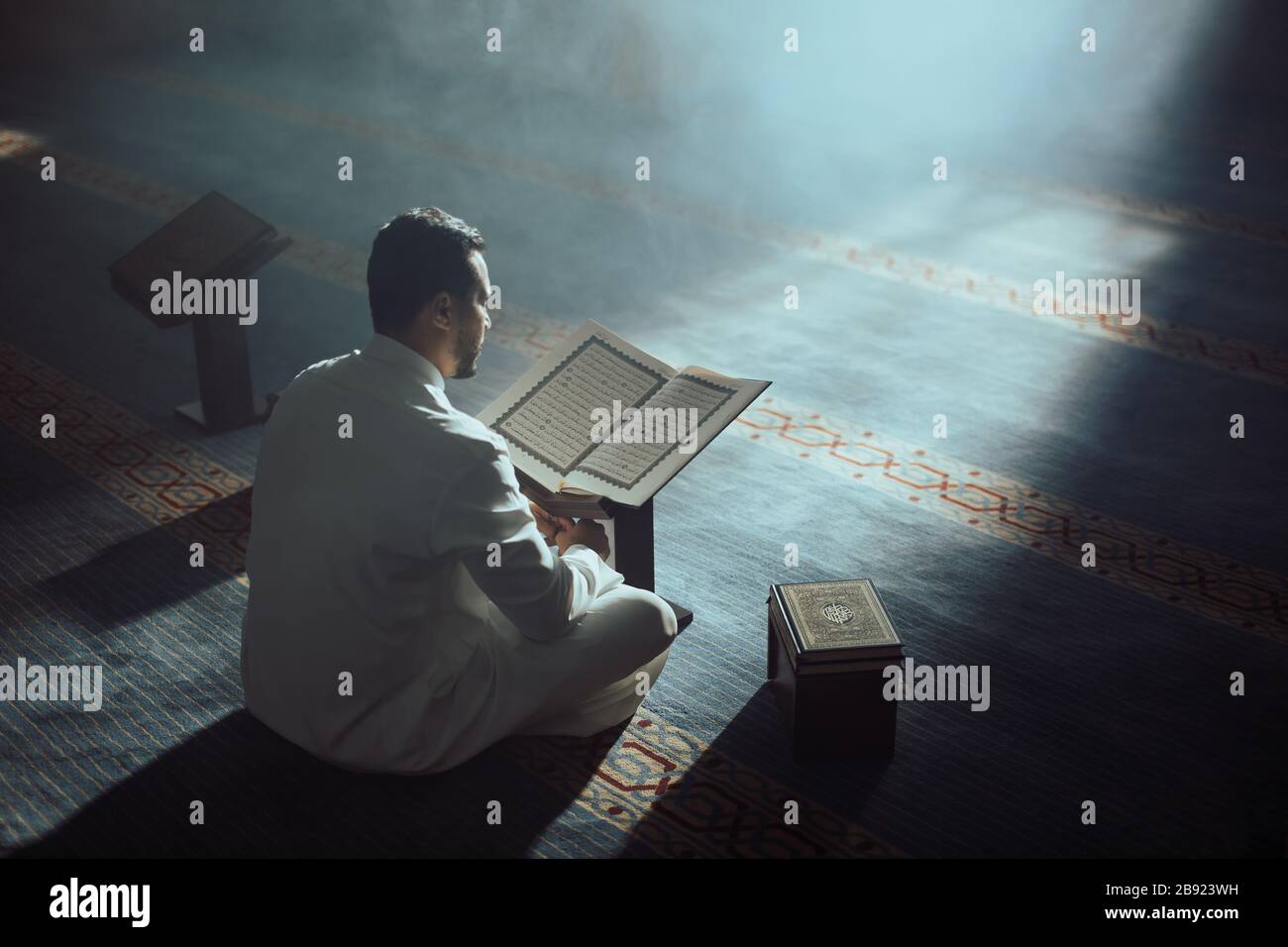 Quran - holy book of Islam mosque Muslim in mosque enuntiat Quran in ...