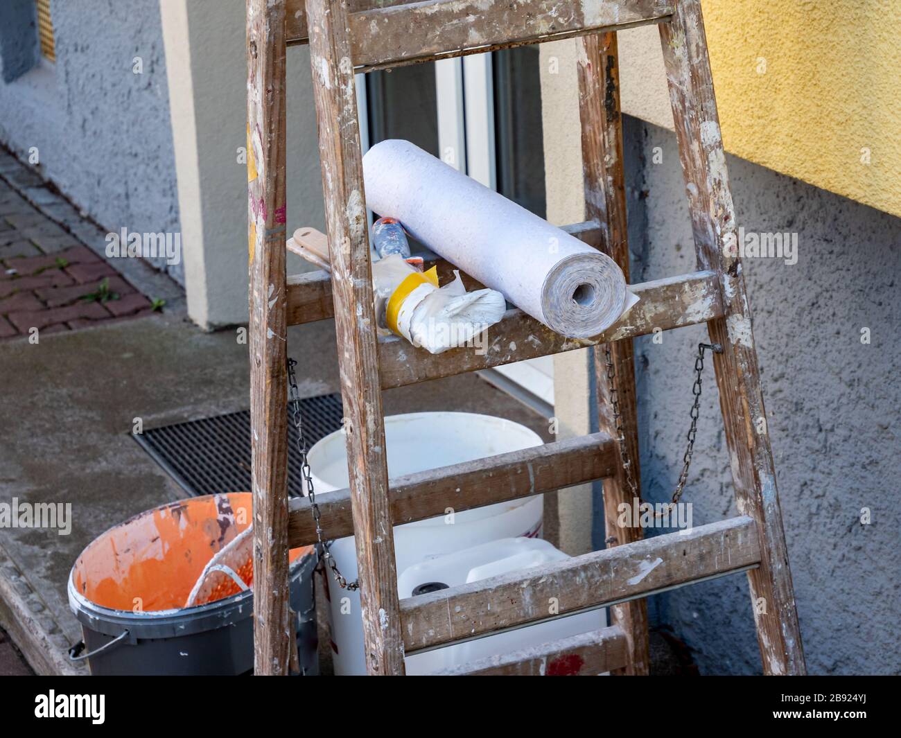 Painter construction site renovation ladder wallpaper Stock Photo - Alamy