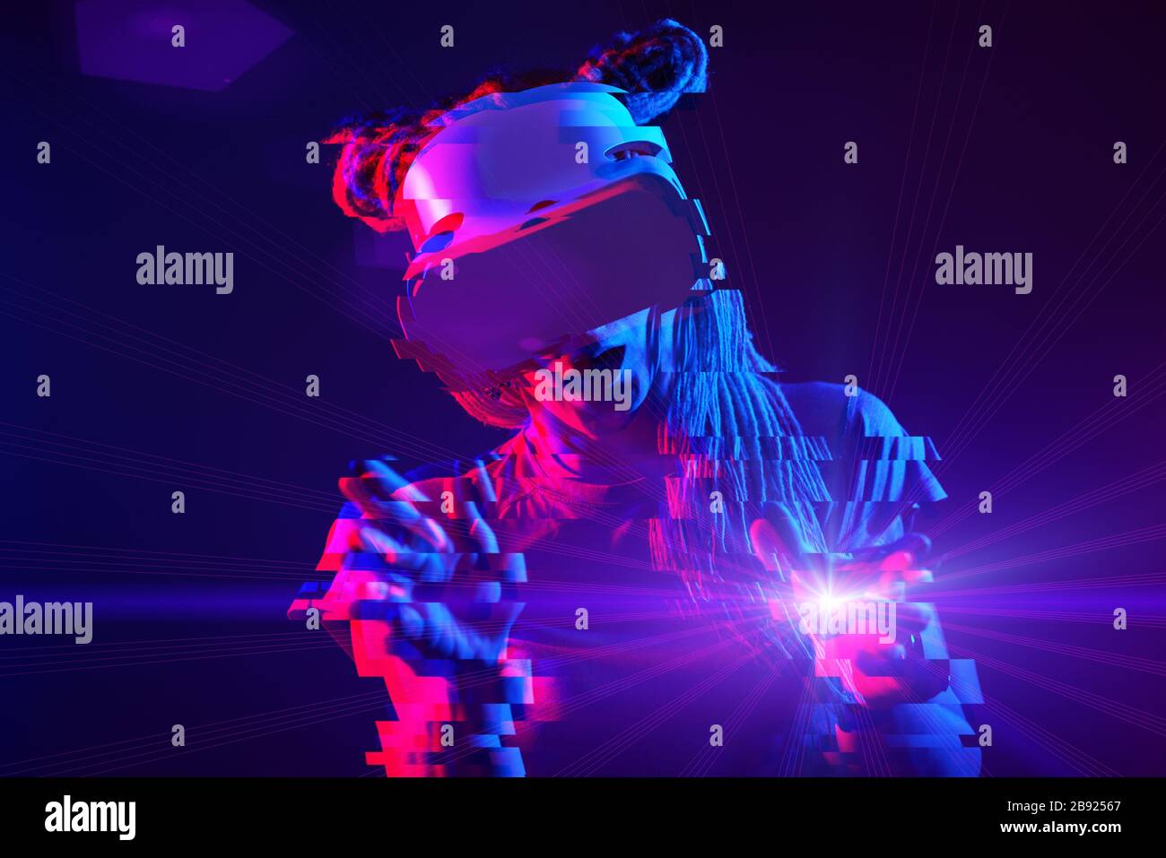 Woman is using virtual reality headset. Neon light studio portrait ...