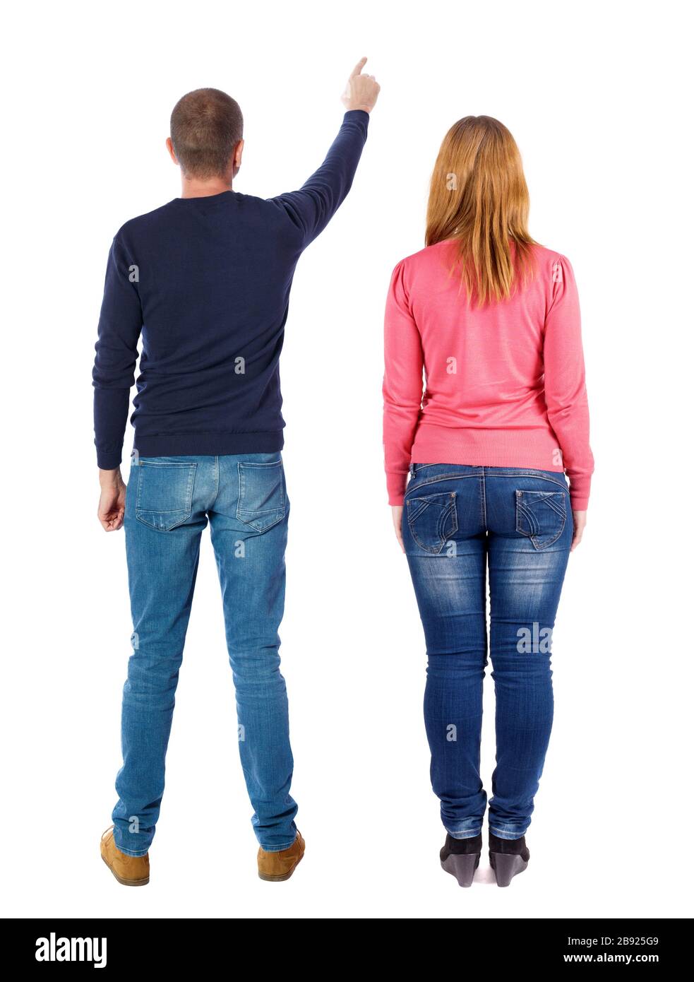 Back view of couple in sweater pointing. Rear view people collection ...
