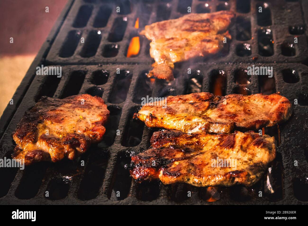 Pork steaks on the grill. Serbian barbecue Stock Photo - Alamy
