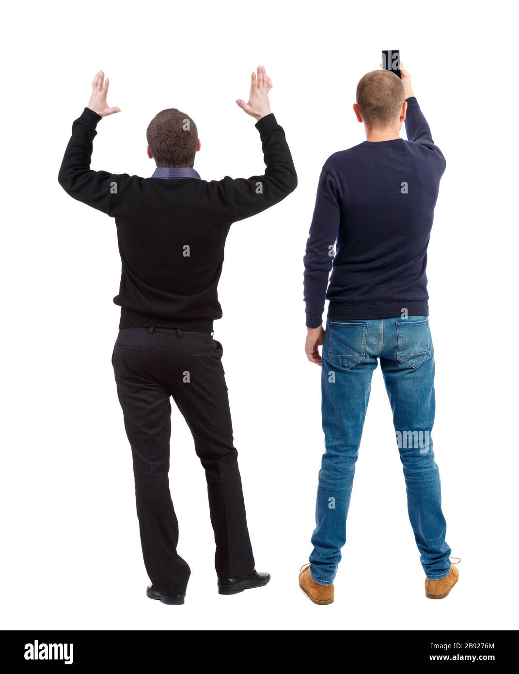 Back view of two man in sweater with mobile phone. Rear view people ...