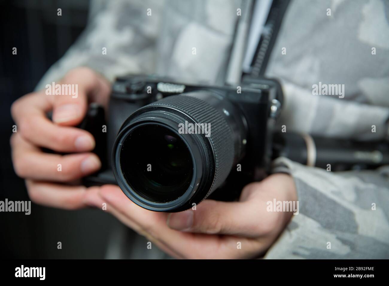 Man holding gimbal stabilizer outdoor. Gimbal Operator with black ...