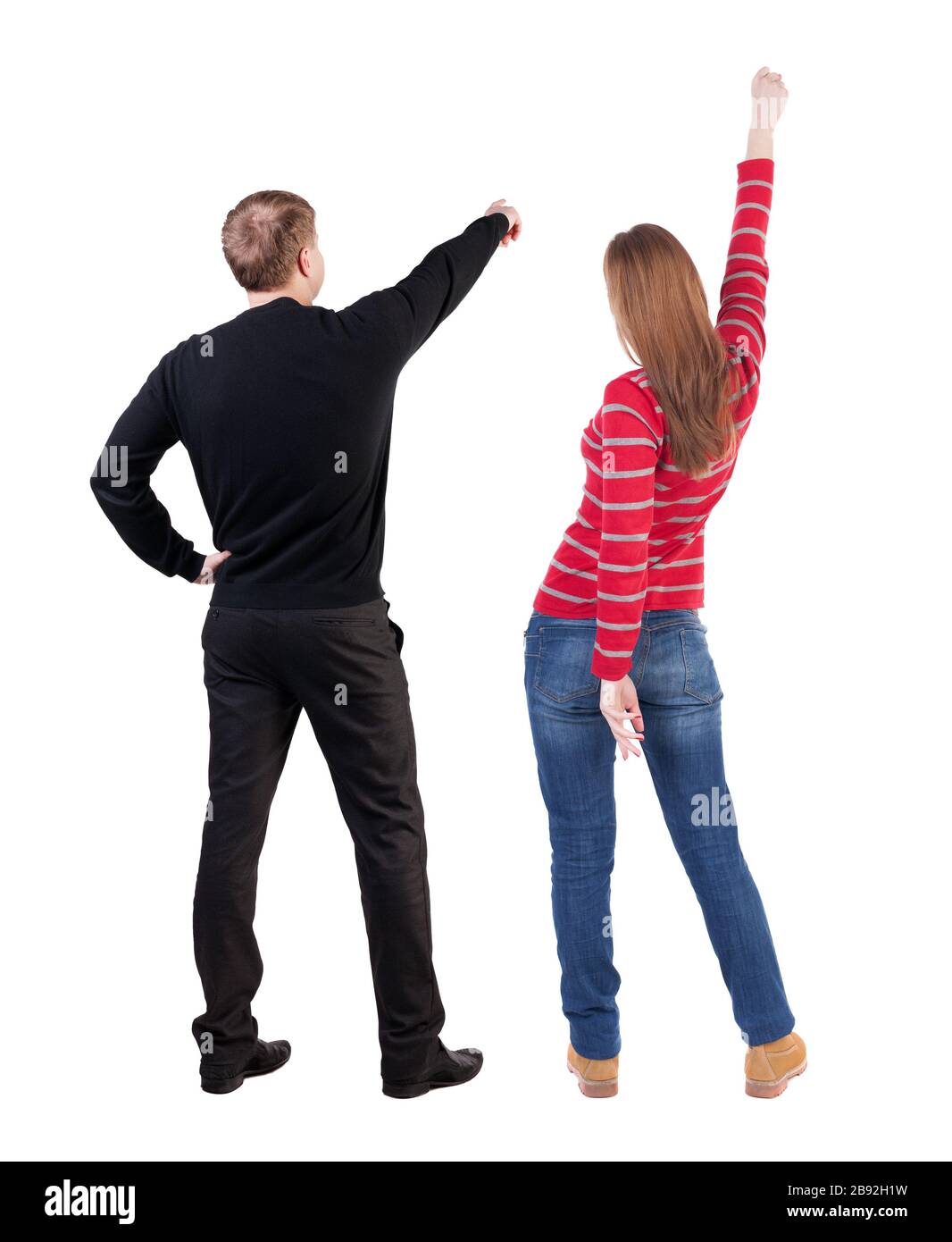 Back view of couple in sweater pointing. Rear view people collection ...