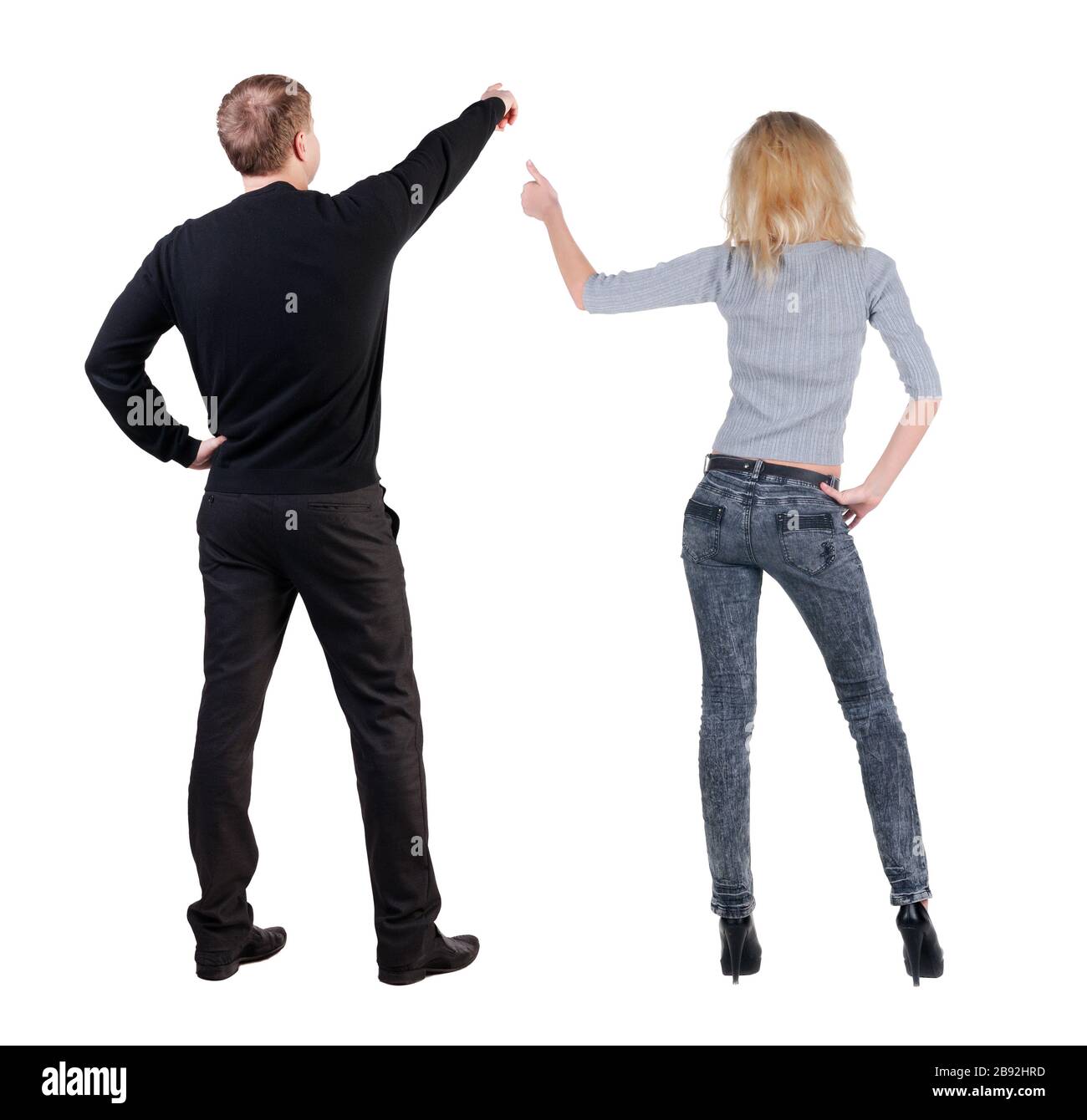 Back view of couple in sweater pointing. Rear view people collection ...