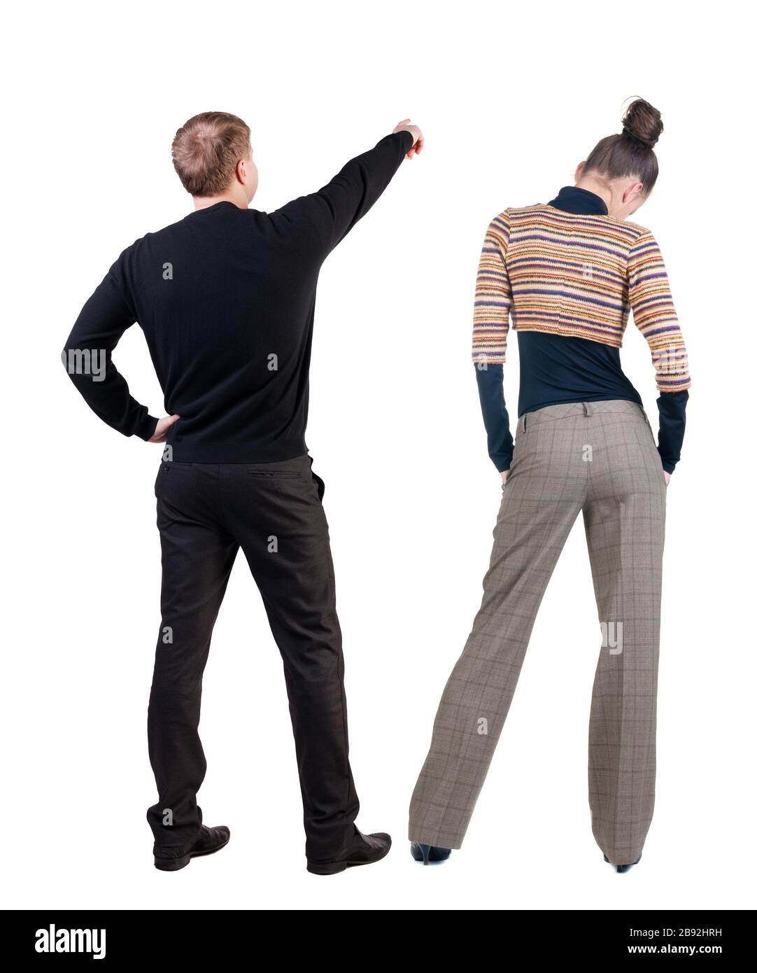 Back view of couple in sweater pointing. Rear view people collection ...