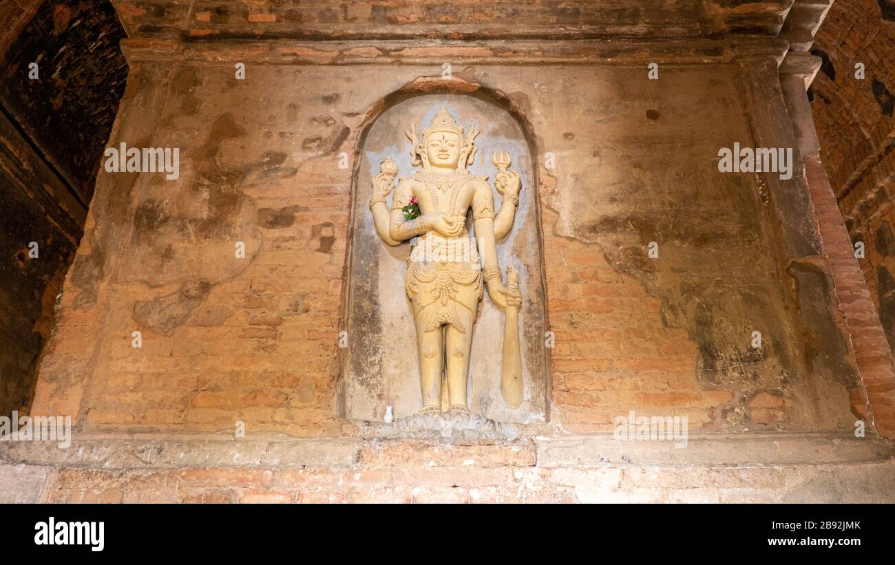 Buddha Statue inside old pagoda Bagan, Myanmar. Statues and drawings of ...