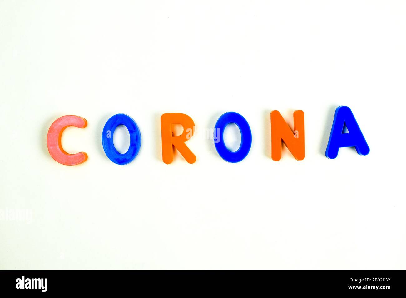 CORONA word written in various colored letter blocks on a isolated ...