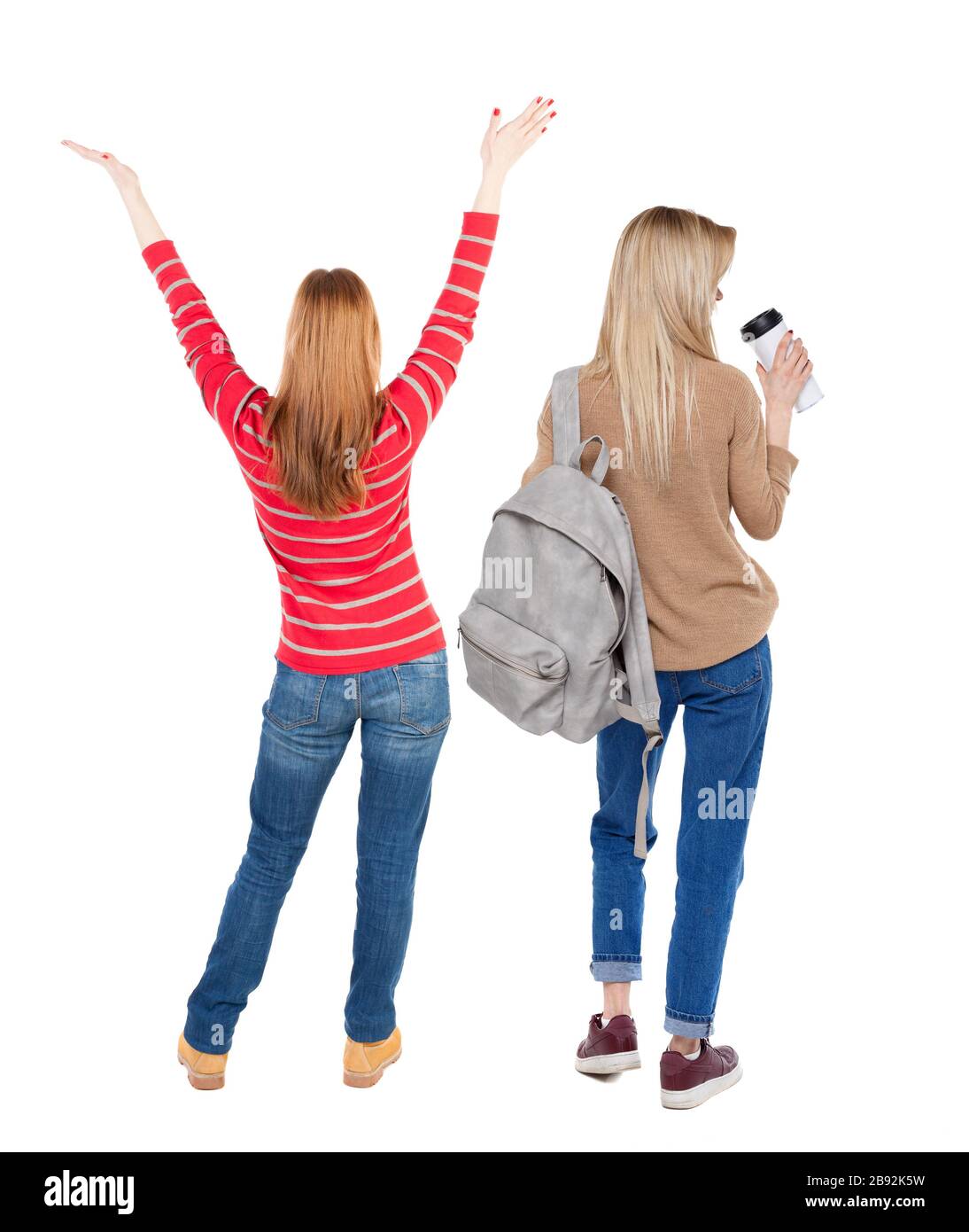 Back view of two woman in sweater. Rear view people collection ...