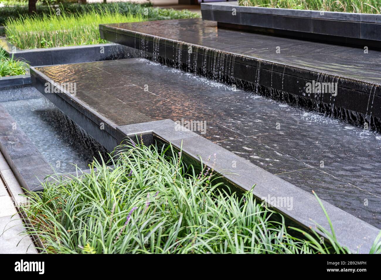 Small Cascade in the Open Air Courtyard. Water Feature as Part of Landscape Design Stock Photo ...