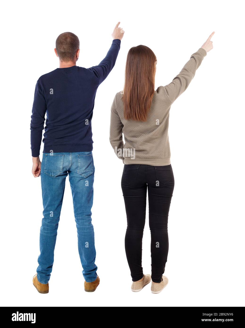 Back view of couple in sweater pointing. Rear view people collection ...