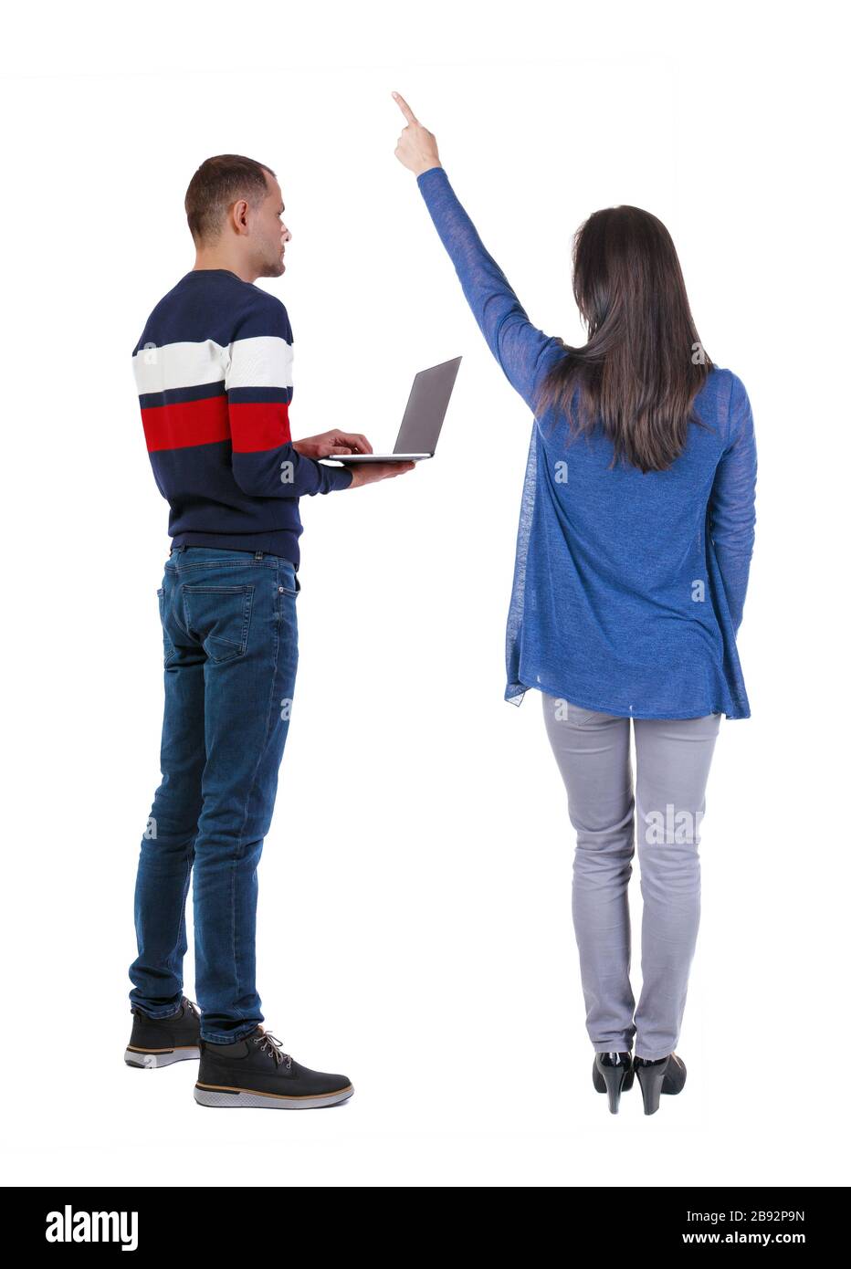 Back view of couple in sweater pointing. Rear view people collection ...