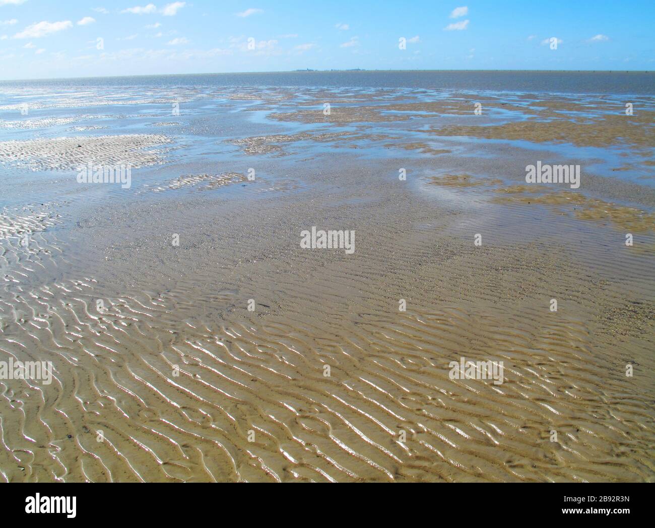 German north sea coast at tide with view to Isle Neuwerk Stock Photo ...