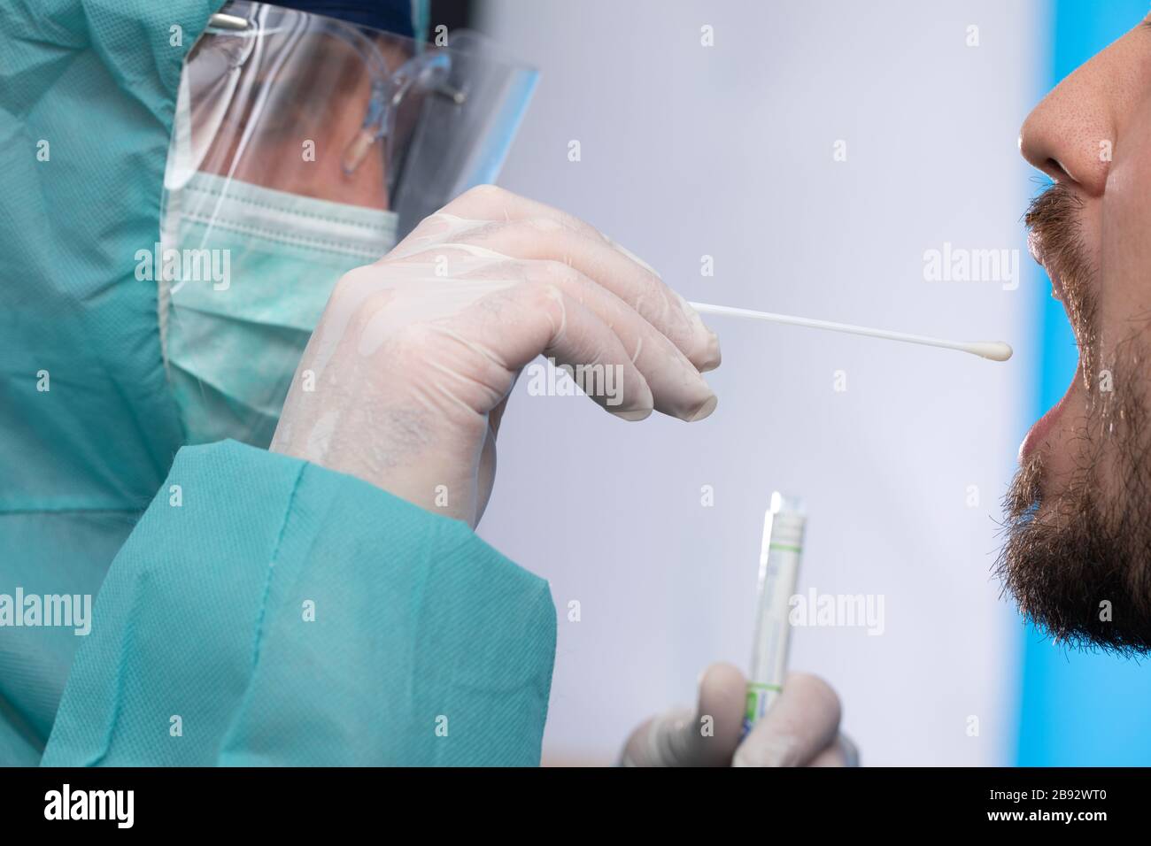 doctor taking saliva test sample Stock Photo - Alamy