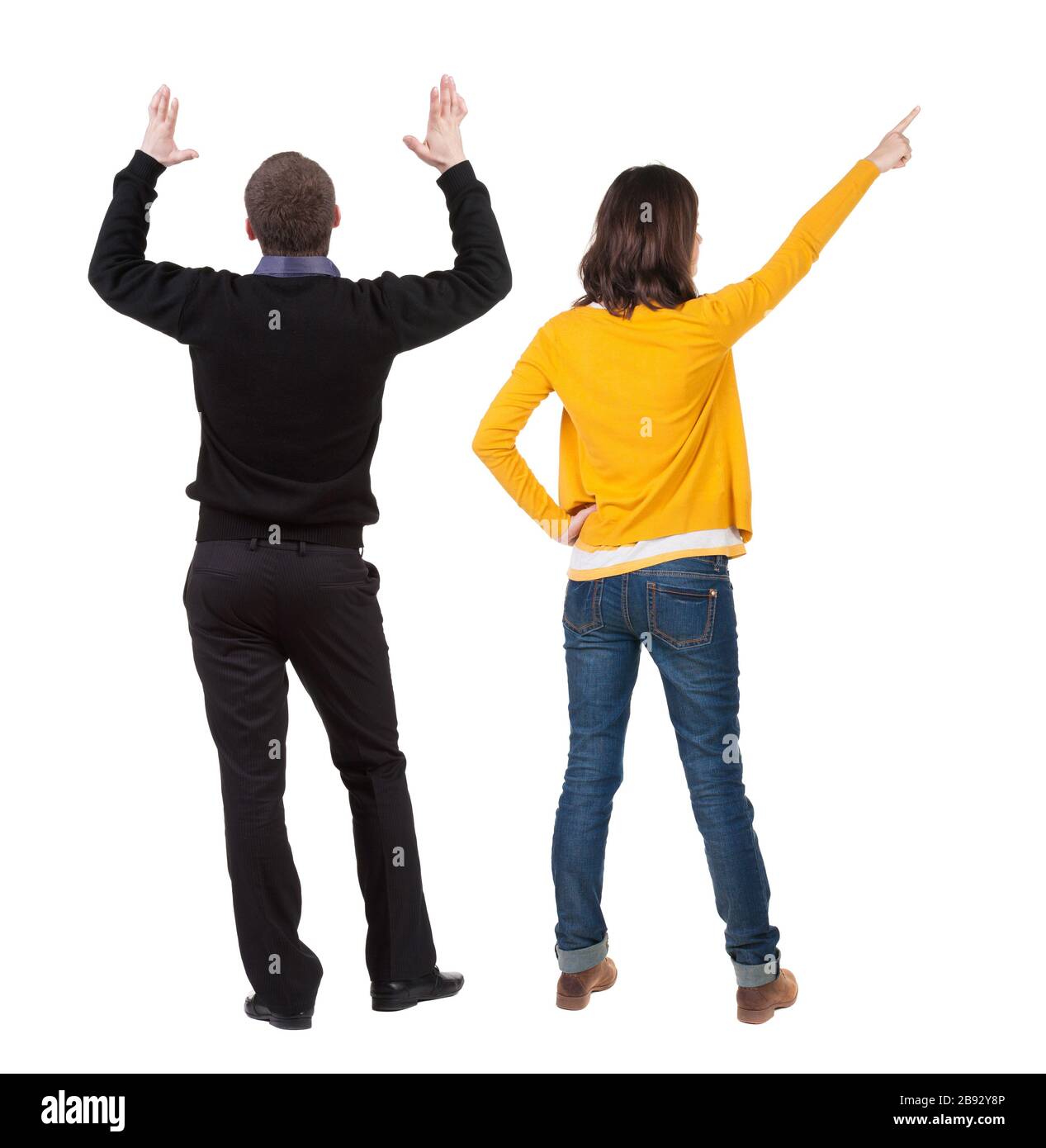 Back view of couple in sweater pointing. Rear view people collection ...