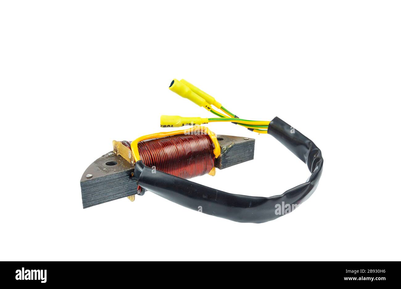A generator coil for an outboard motor on a white background close-up ...
