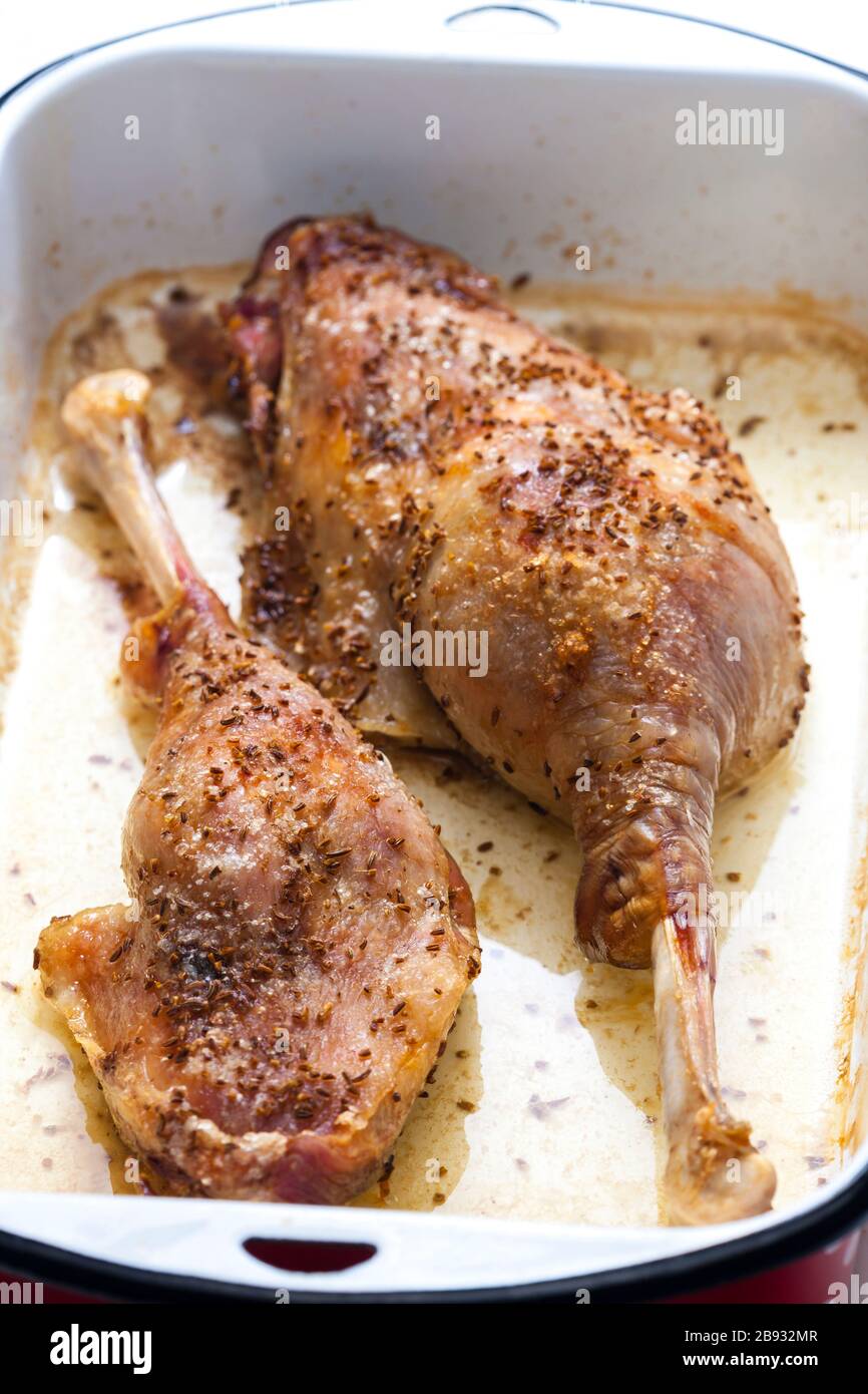 baked goose legs with cumin in frying pan Stock Photo - Alamy