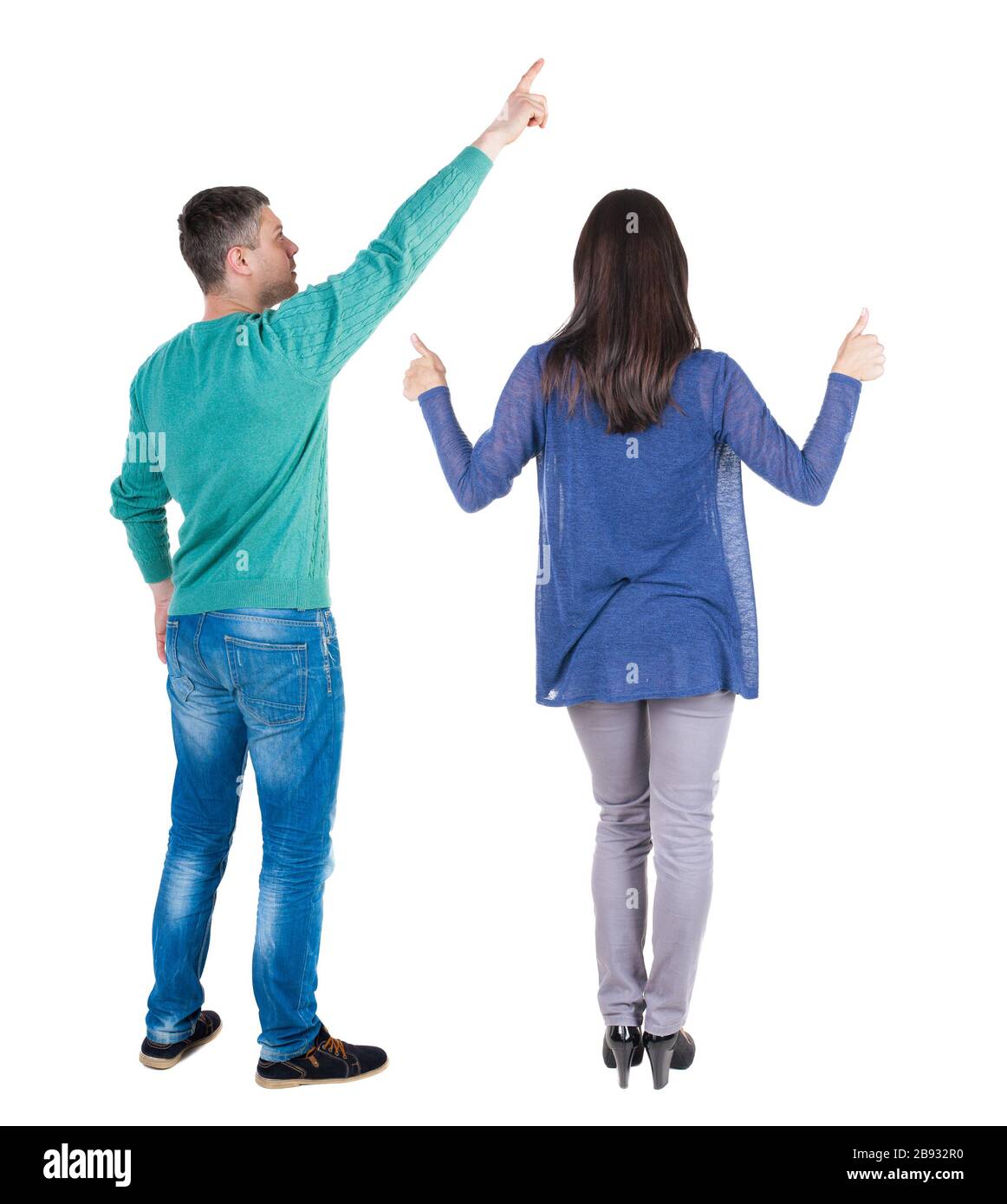 Back view of couple in sweater pointing. Rear view people collection ...