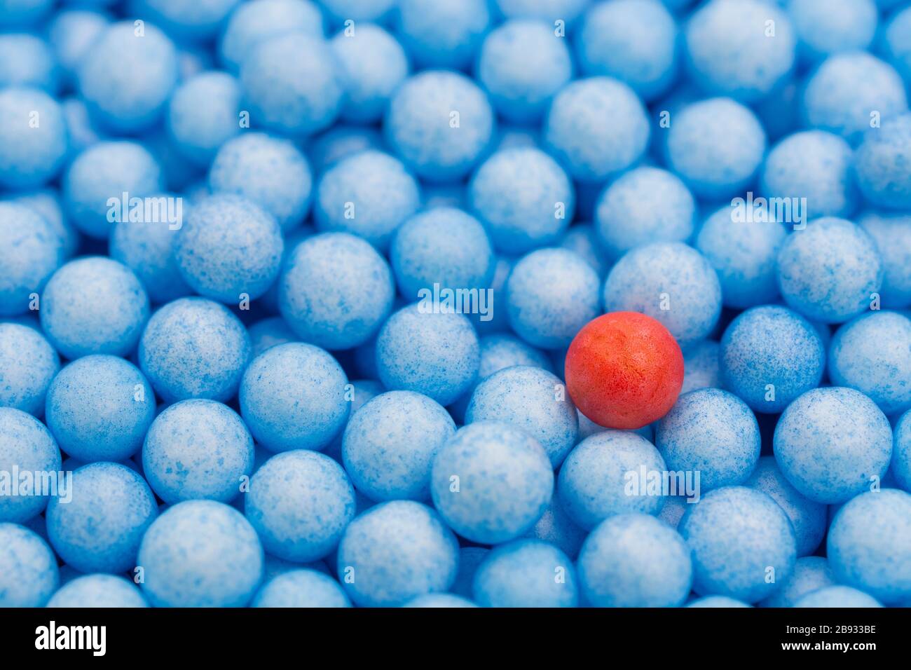 Coloured small blue & red polystyrene balls. Conceptual for Covid-19 ...