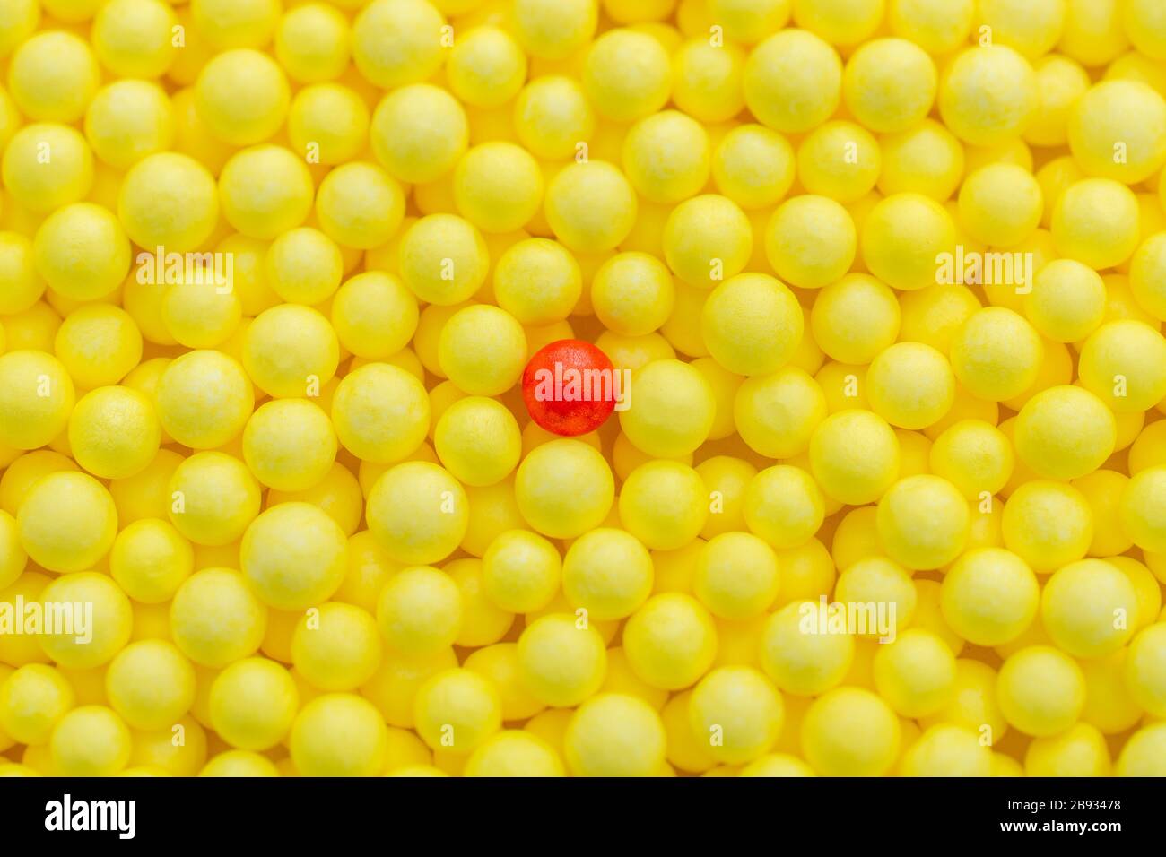 Coloured yellow & red small polystyrene balls. Conceptual for Covid-19 ...