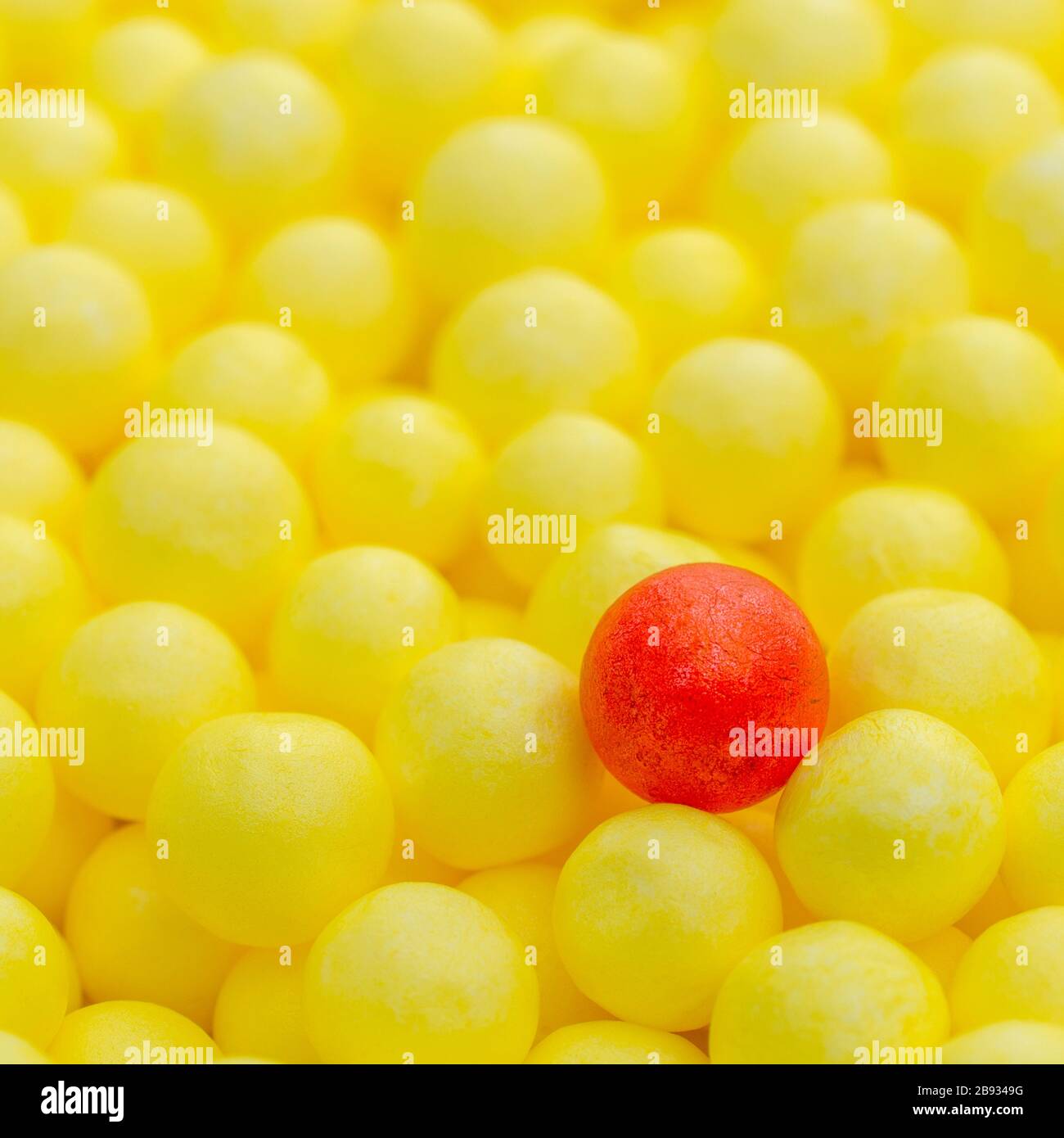 Coloured yellow & red small polystyrene balls. Conceptual for Covid-19 ...