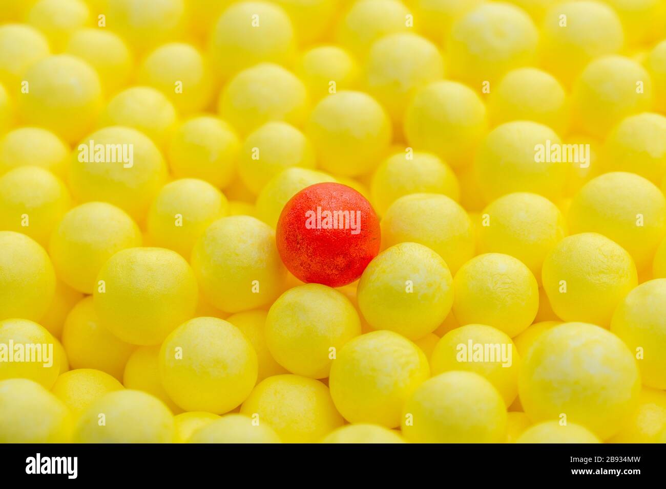 Coloured yellow & red small polystyrene balls. Conceptual for Covid-19 ...