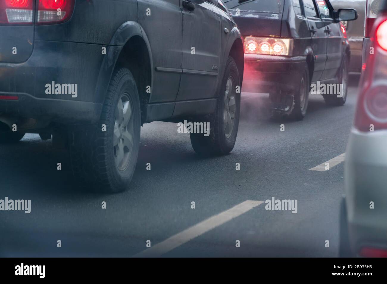 Cars standing in a traffic jam on a city street Stock Photo - Alamy