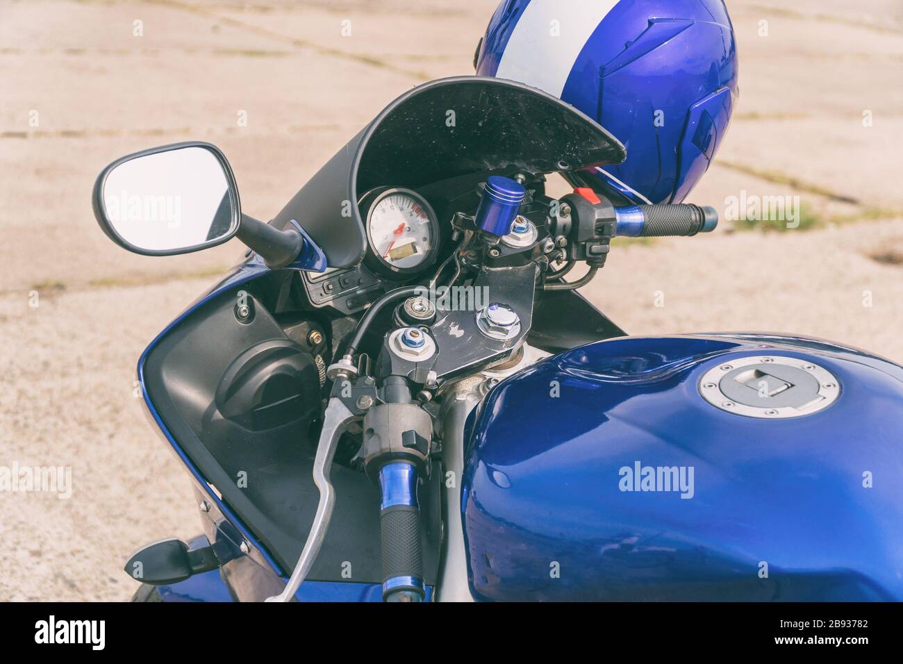 View of the fuel tank and steering wheel of a motorcycle with mirrors ...