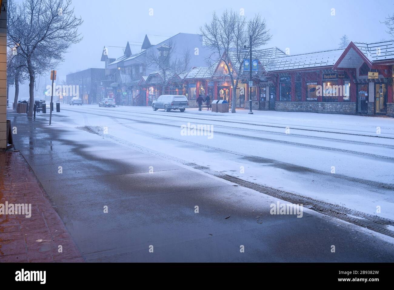 Canmore, Alberta, Canada – March 21, 2020: Falling snow in the evening ...