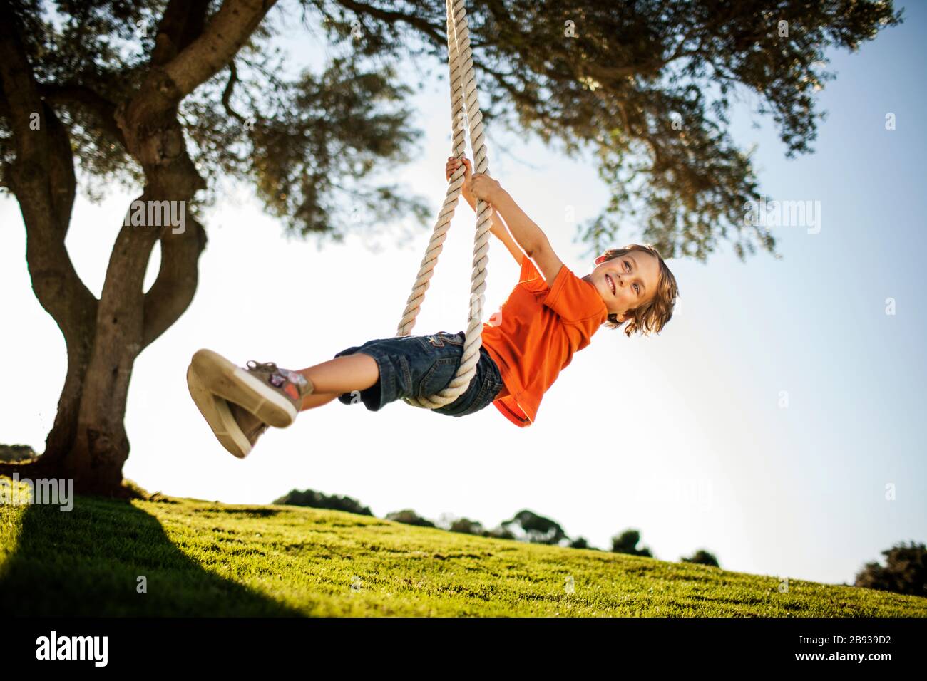 Children playing on grassy field hi-res stock photography and images ...