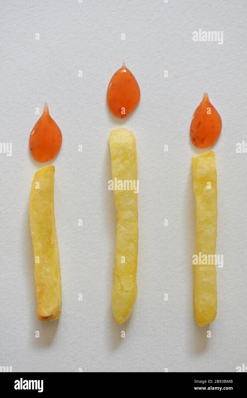 Abstract Birthday Burning French Fries Candle Stock Photo - Alamy