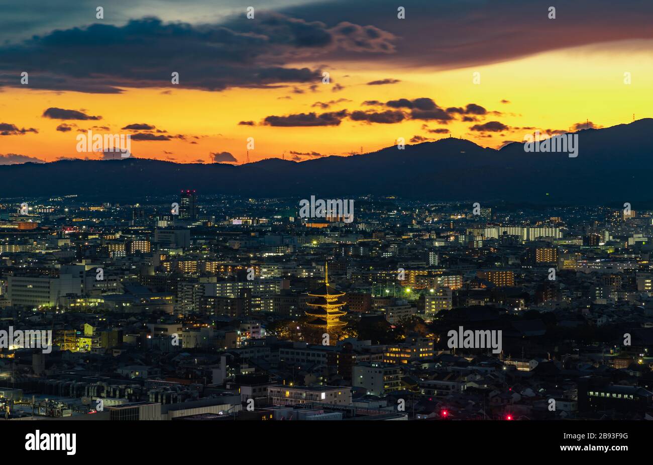 A picture of the city of Kyoto, taken at sunset, showing the Tō-ji ...