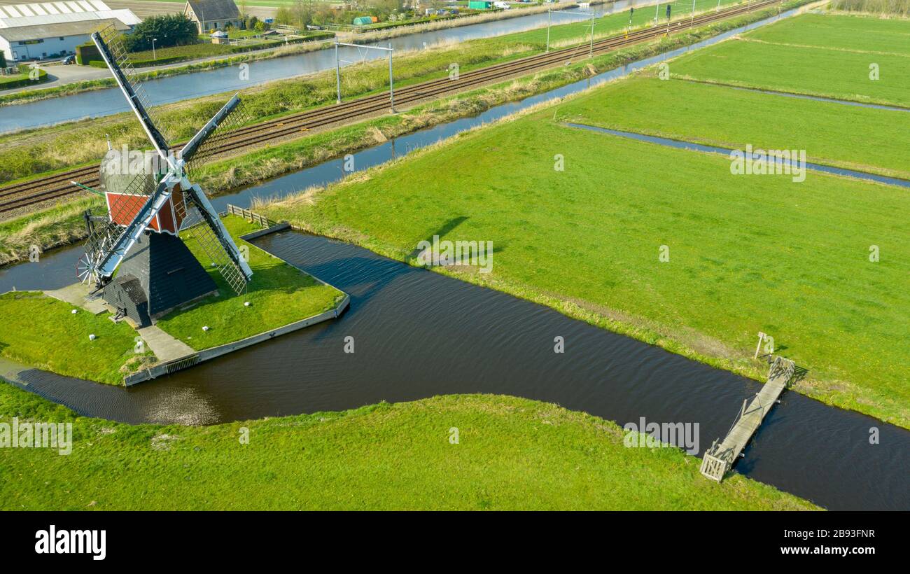 Aerial view of a old dutch traditional windmill on the rural ...