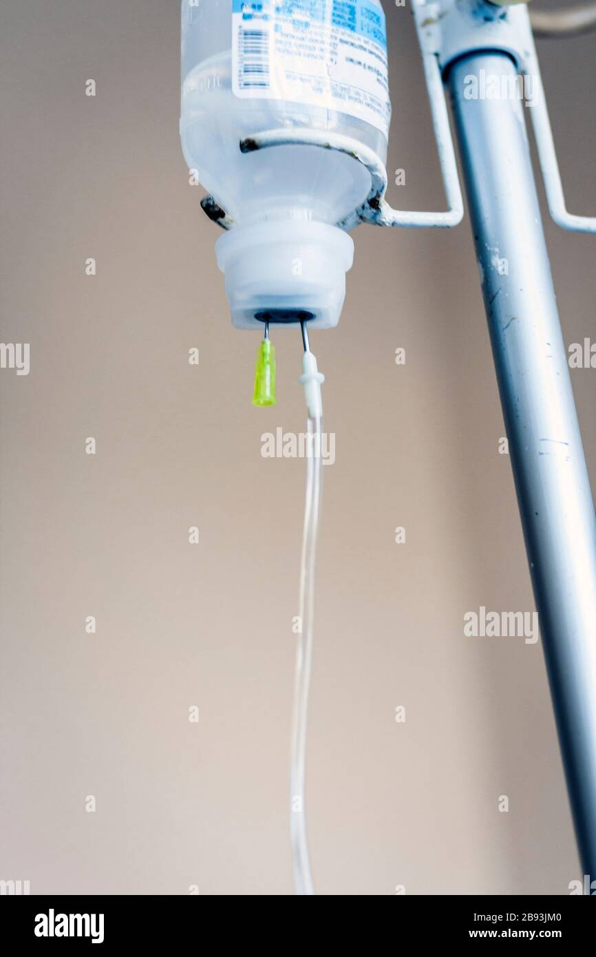 Close-up bottle of medicine on dropper system in the operating room ...