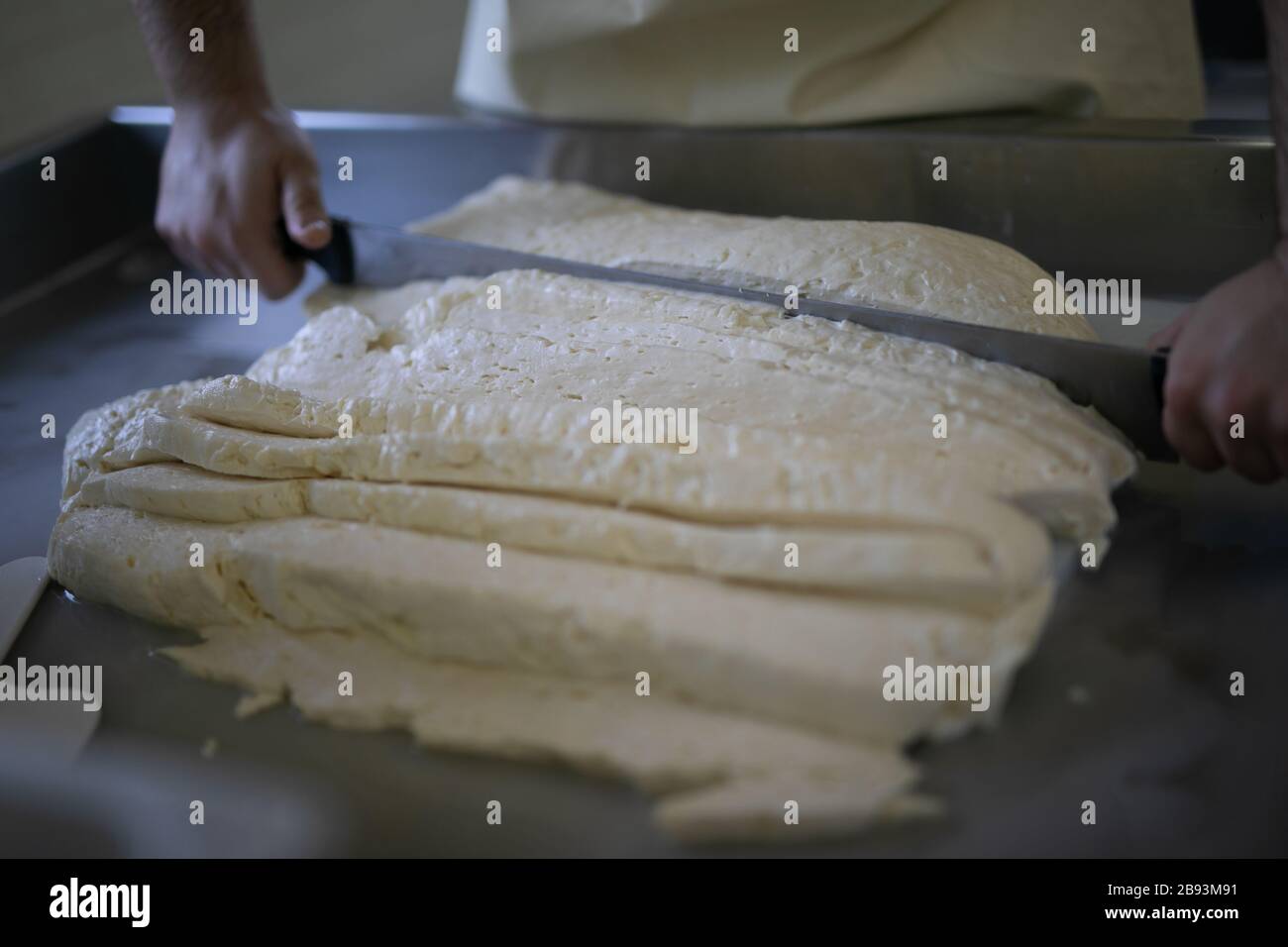 traditional farm mozzarella cheese manual preparation Stock Photo - Alamy