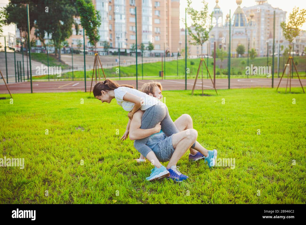Fit couple in city, having fun, taking break. Happy sport couple ...