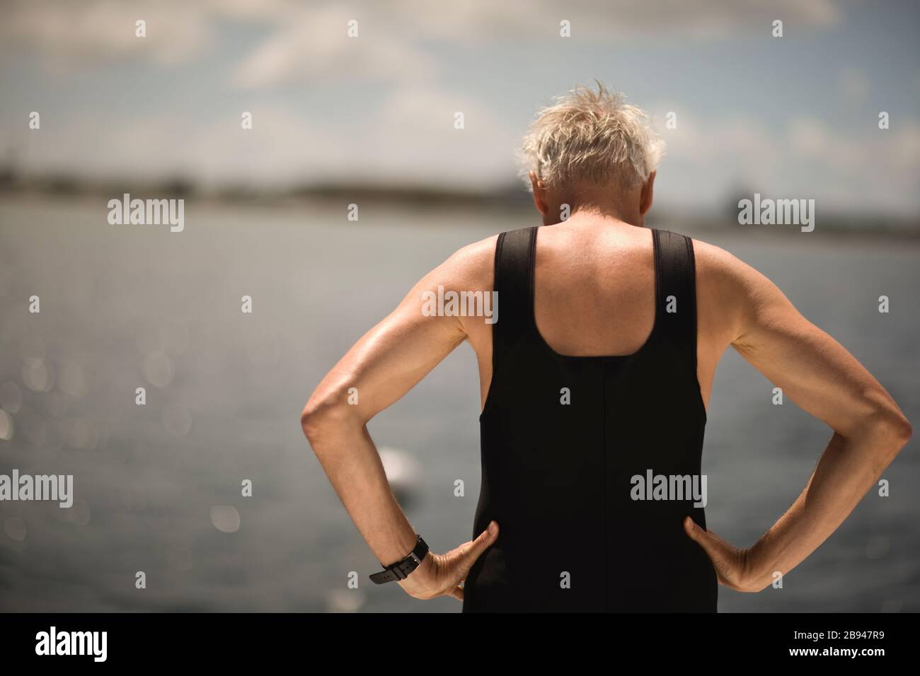 Rear view of old man wearing black singlet Stock Photo - Alamy