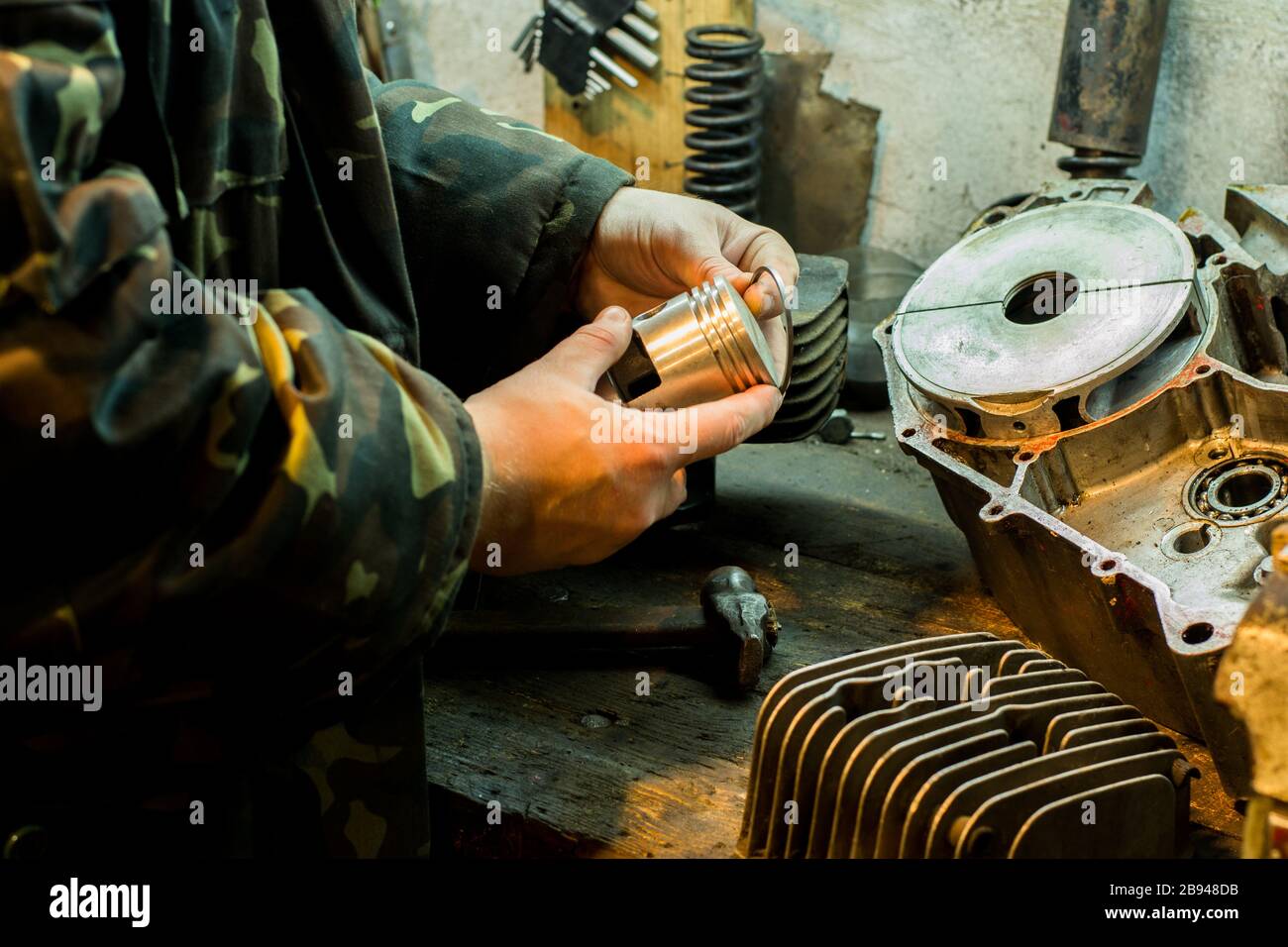 Repair of old vintage motorcycle engine in the garage Stock Photo - Alamy