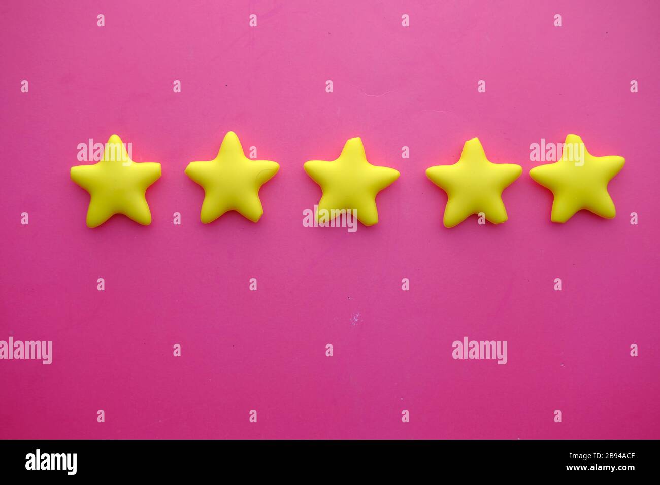 five star rating white background, close up Stock Photo - Alamy