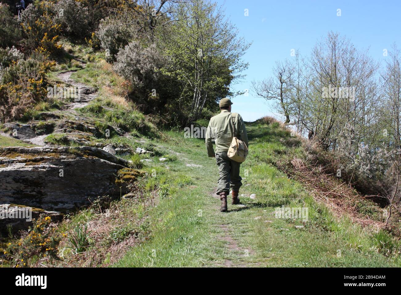 American soldiers fight at the front climbing the steep green wild ...