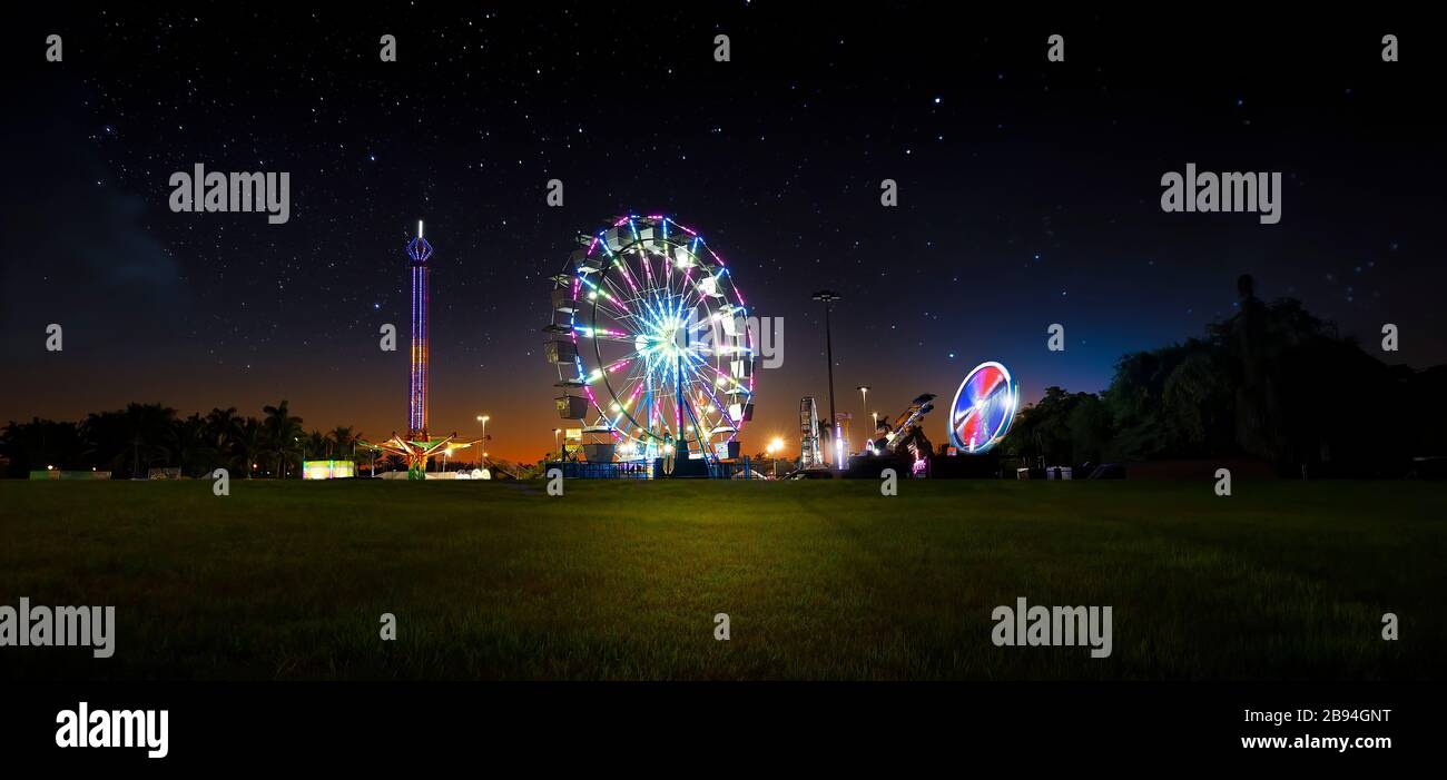The lights of a county fair beckon you to enjoy the midway on a clear ...
