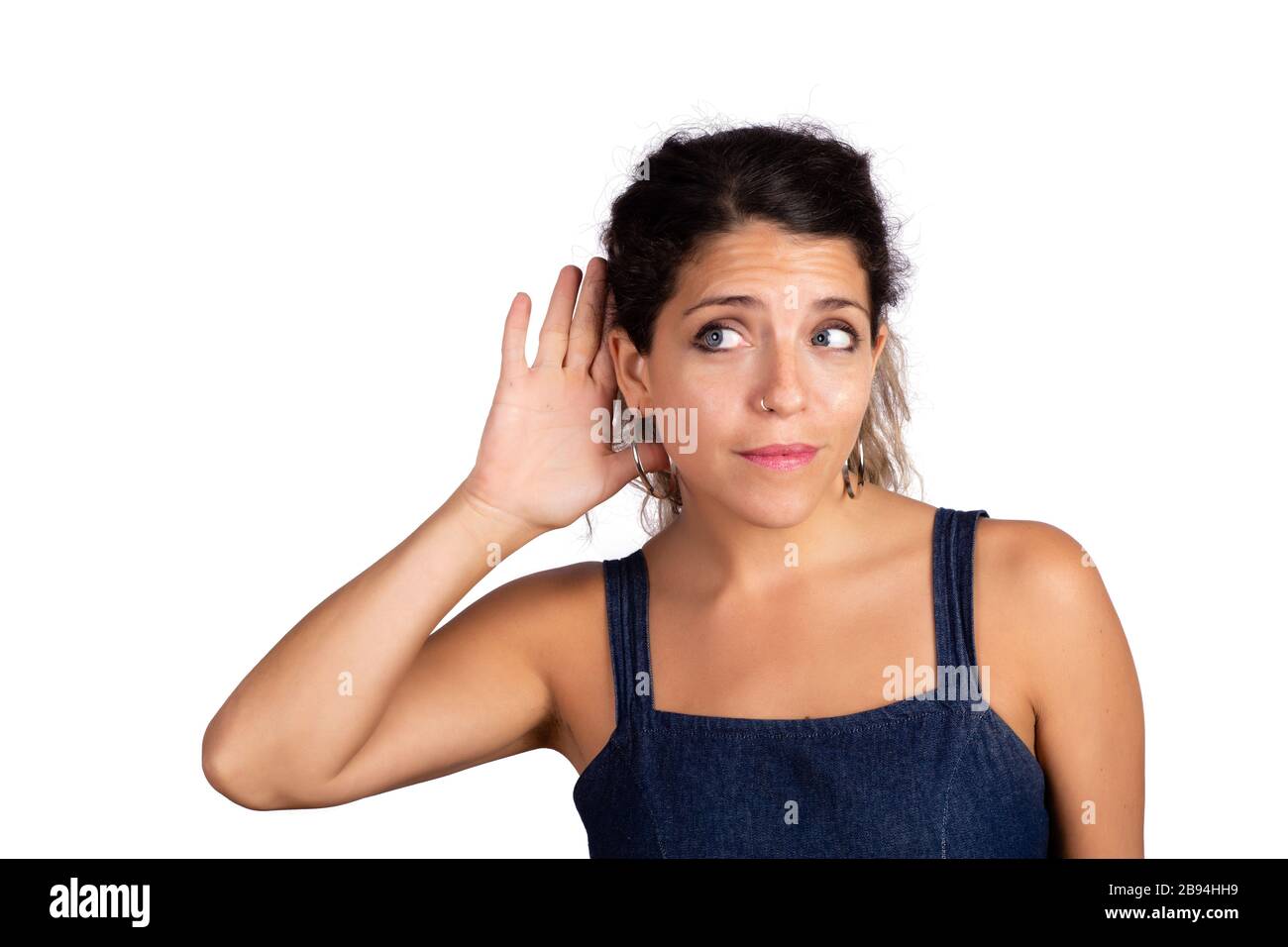 Woman with hand to ear hi-res stock photography and images - Alamy