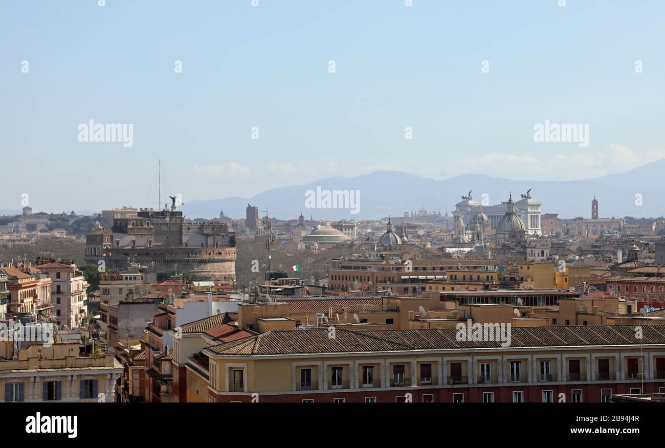 panorama of the city of rome with the roofs of houses and buildings ...