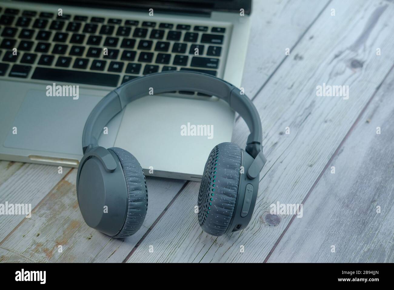 Headset or headphone on laptop, top view Stock Photo - Alamy