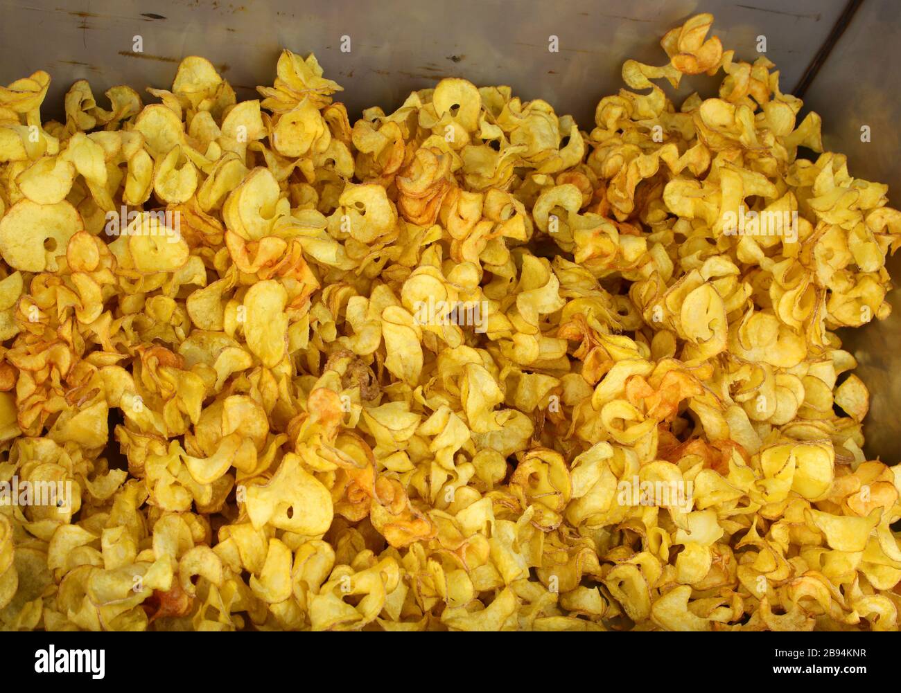 many yellow fried fries for sale in the street food stall Stock Photo ...