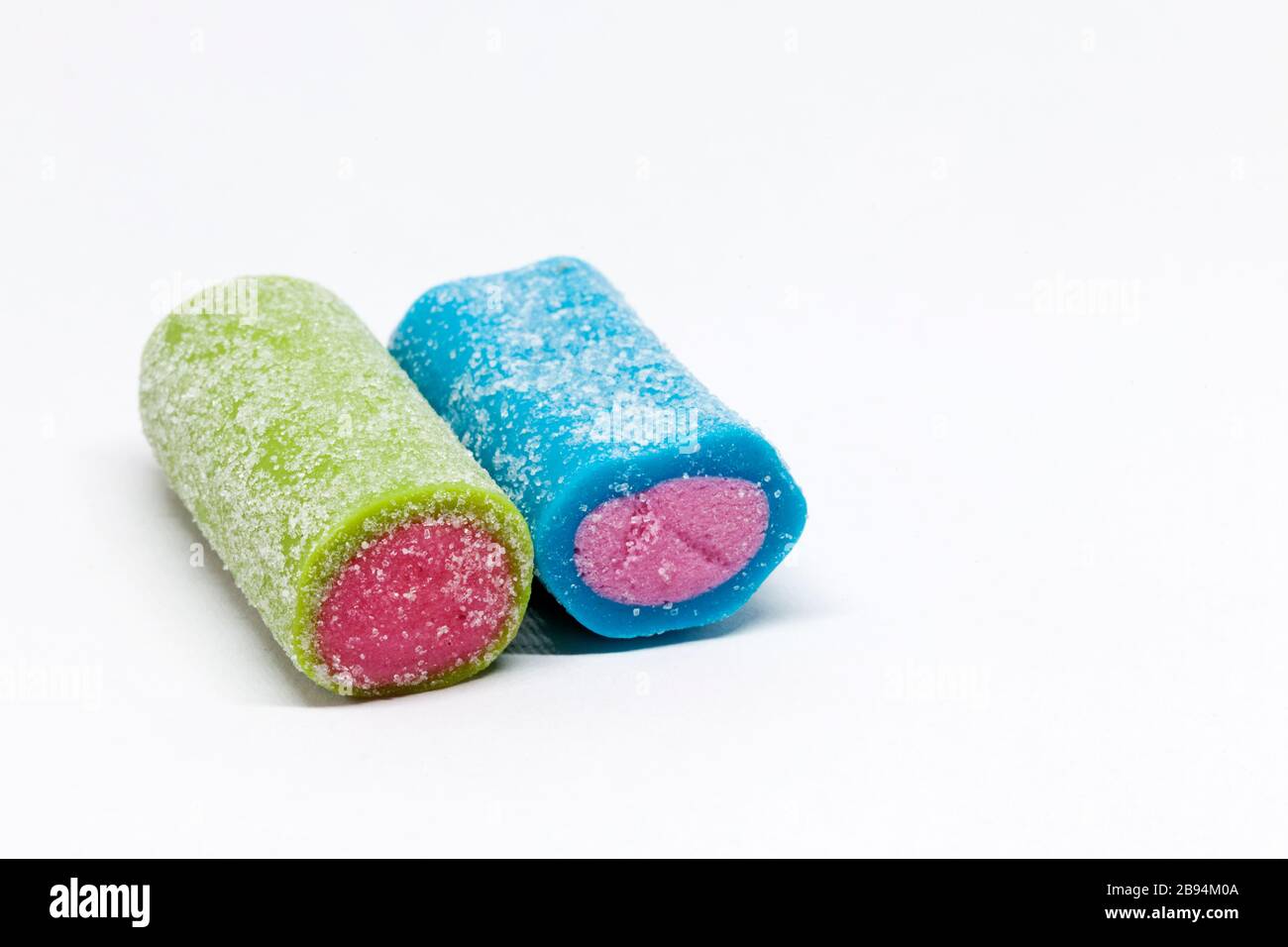 a blue and green candy roll on white background Stock Photo - Alamy