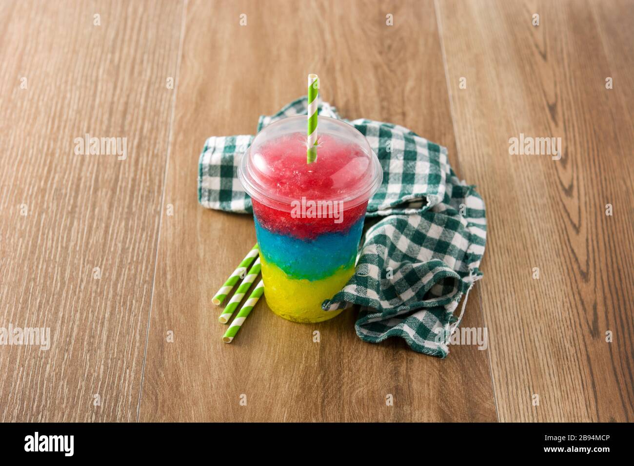 Colorful slushie of differents flavors with straw in plastic cup Stock ...