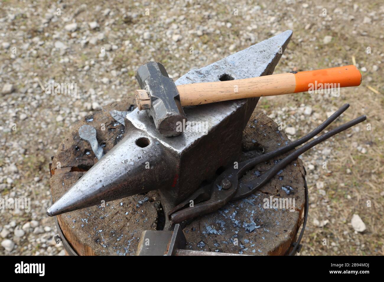 large and heavy anvil and a hammer in the blacksmith's shop Stock Photo ...